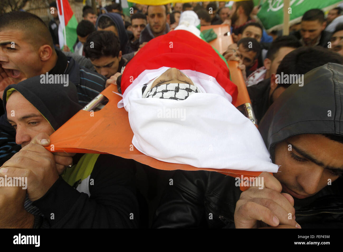 Hebron, West Bank, Palestinian Territory. 6th Feb, 2016. Mourners carry ...
