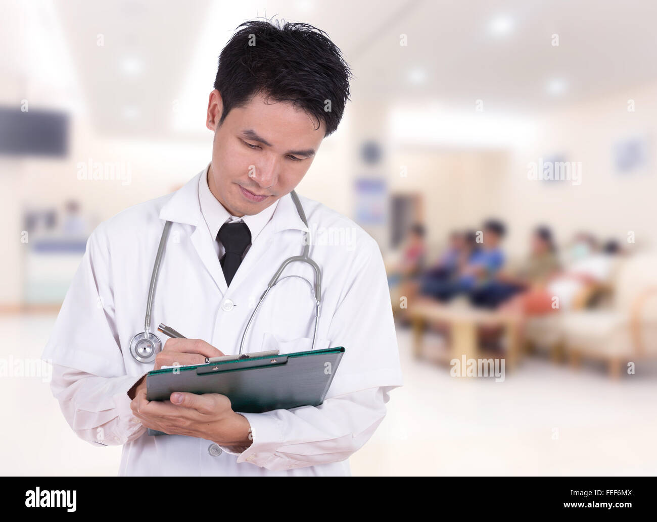Doctor writing chart report hi-res stock photography and images - Alamy