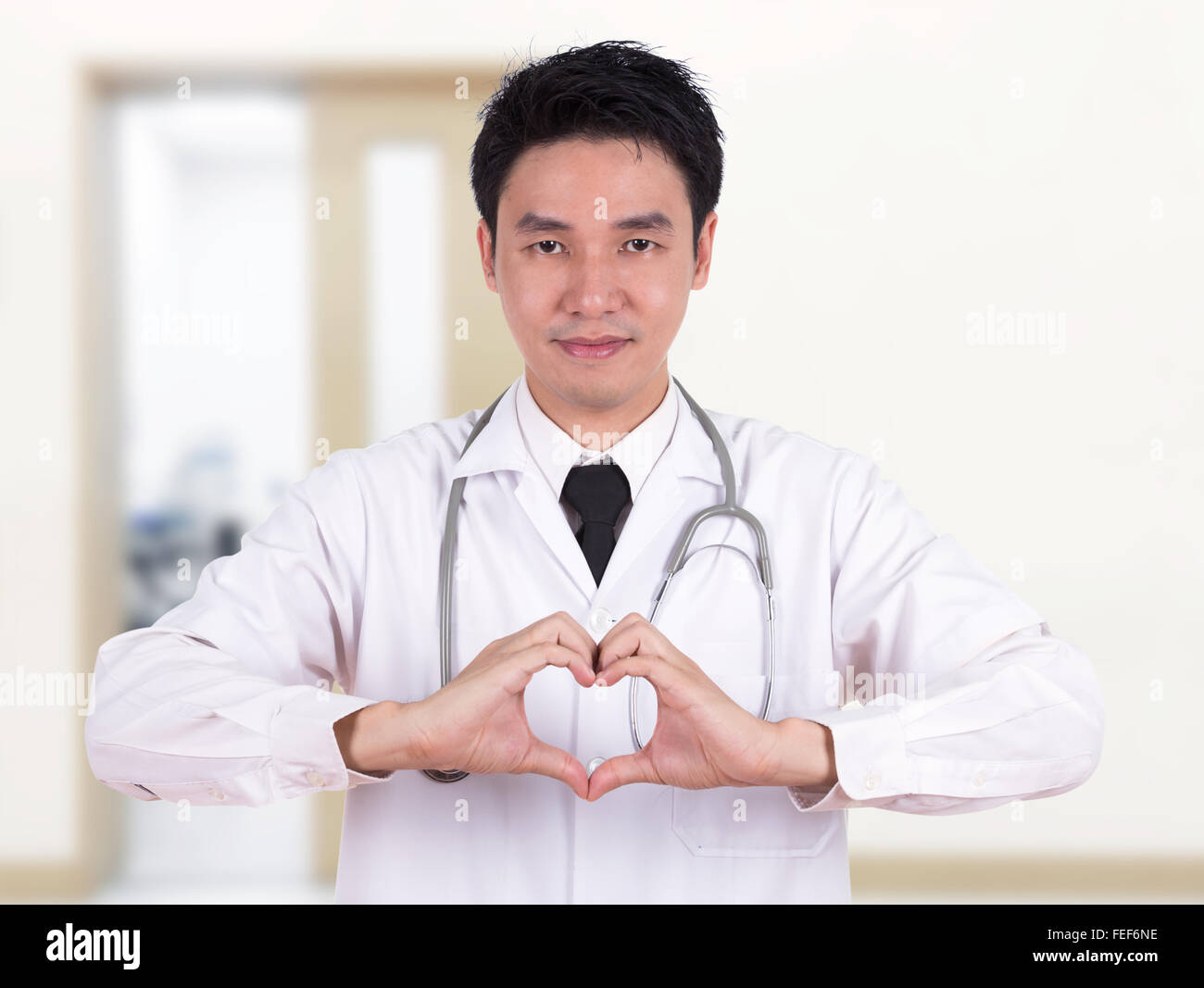 doctor doing a heart with his hands in hospital Stock Photo - Alamy