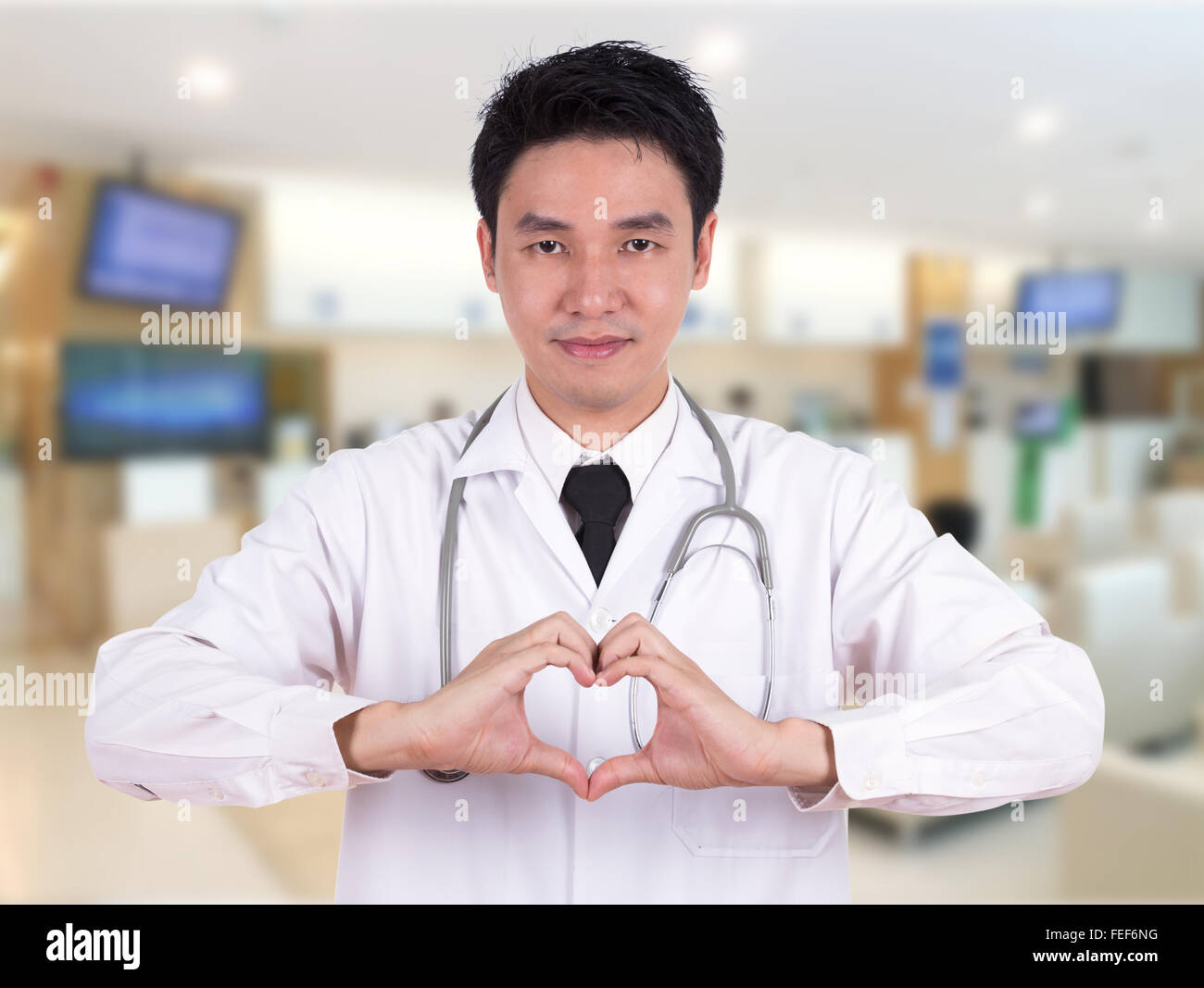 doctor doing a heart with his hands in hospital Stock Photo - Alamy