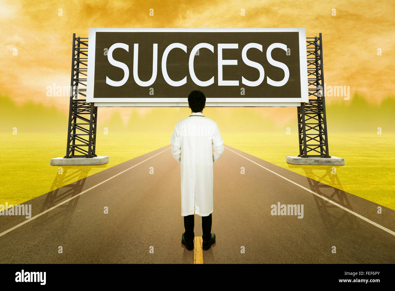 male doctor standing on road and looking with large sign of success at ...