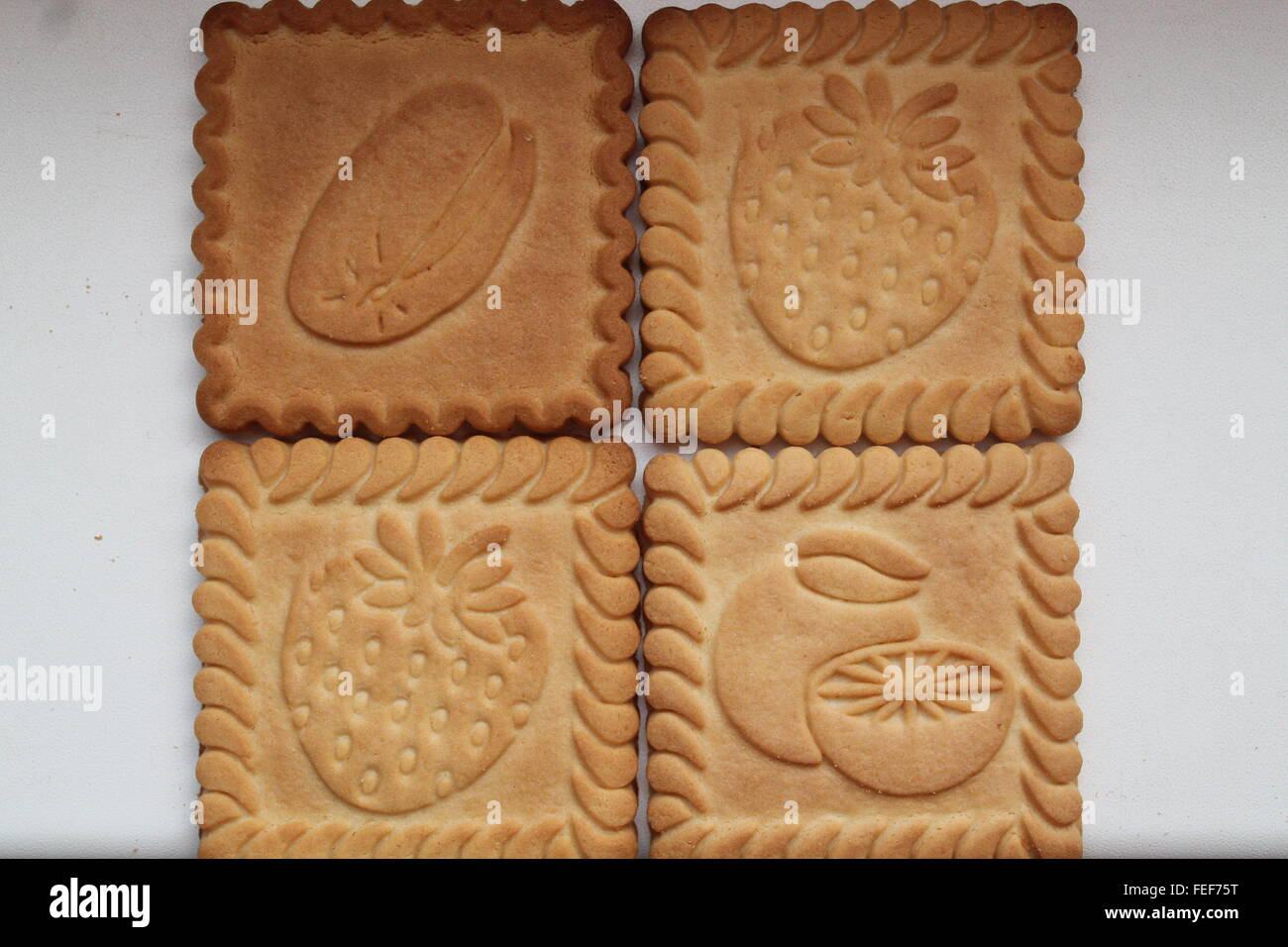 four crust appetizing cookies with images of fruits on Stock Photo - Alamy
