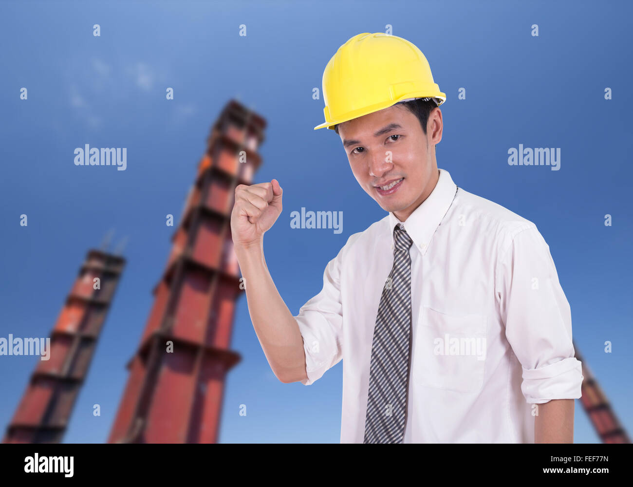 Happy engineer celebrating with arm raised, concept of successful ...