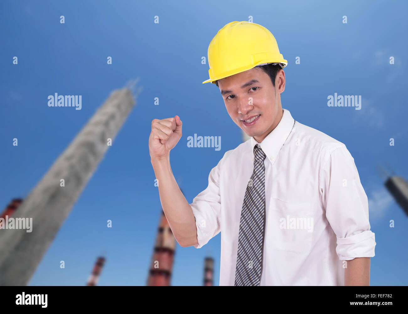 Happy engineer celebrating with arm raised, concept of successful ...