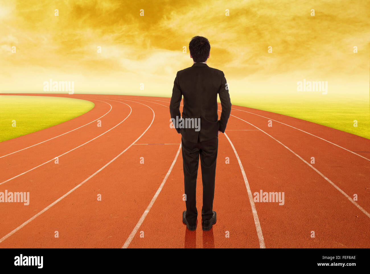 businessman standing on running track and looking to goal (business ...