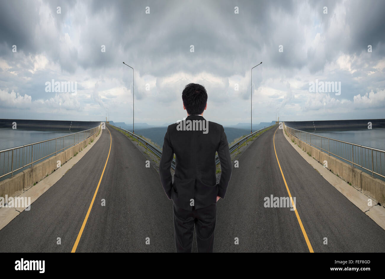 business man has to decide between two different way Stock Photo - Alamy