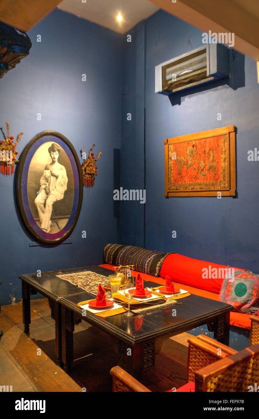 Exotic, rustic Asian themed dining room Stock Photo - Alamy