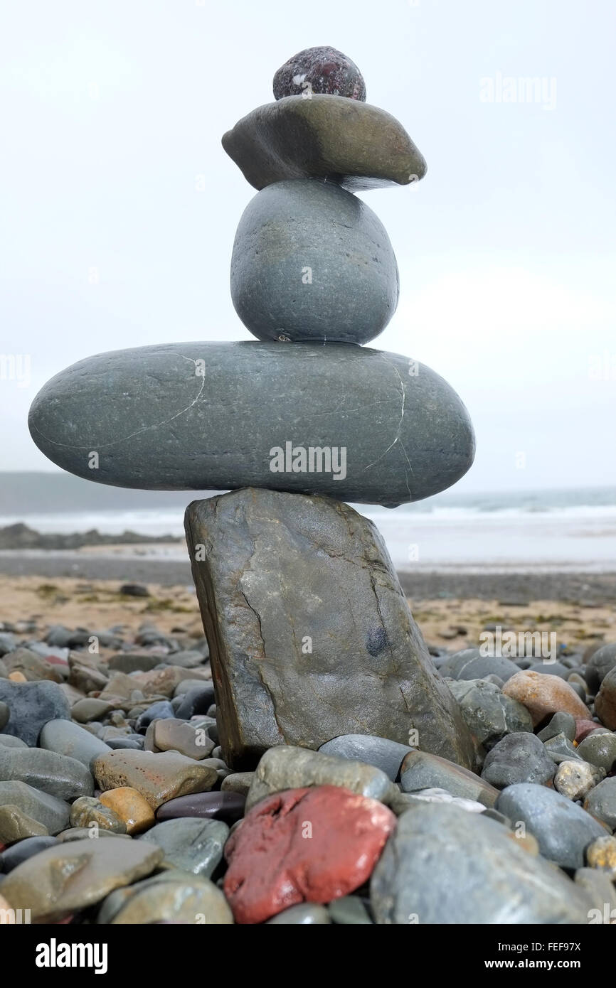 Piles of rocks balanced on top of each other on teh beach at Marloes in ...