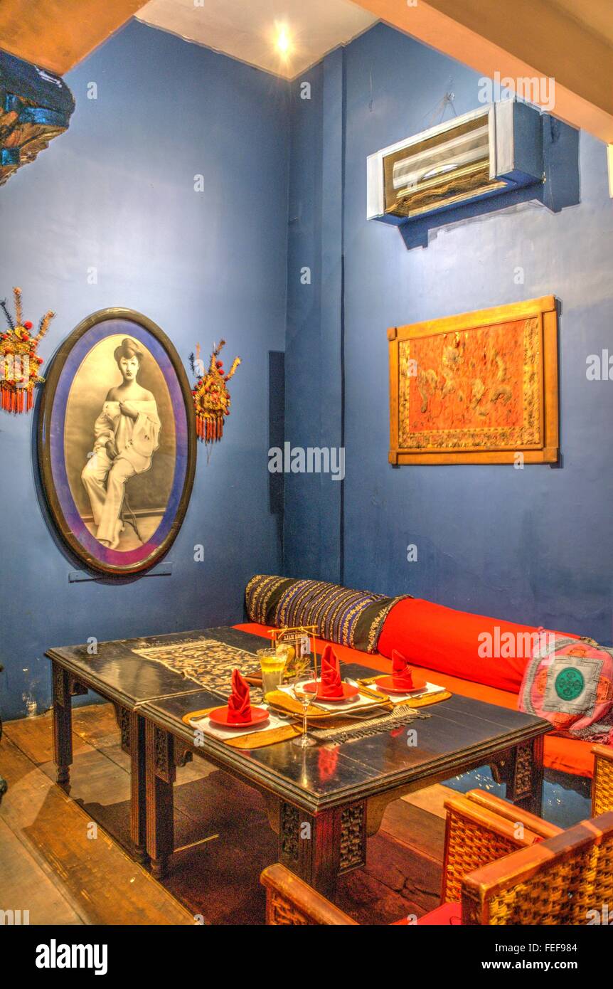 Exotic, rustic Asian themed dining room Stock Photo - Alamy
