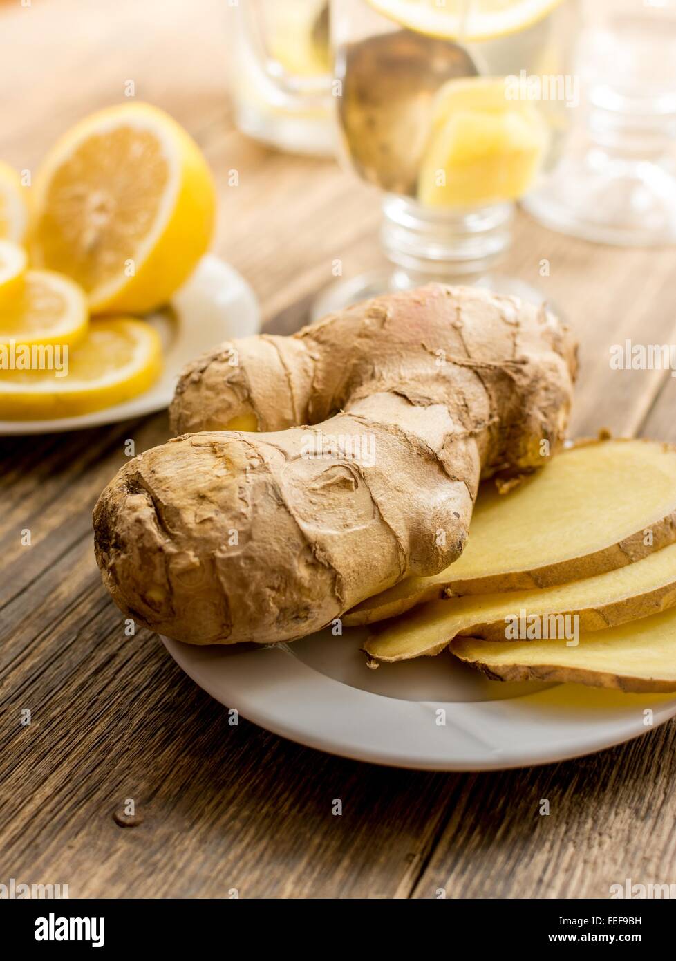 Cut of raw ginger on wood table Stock Photo - Alamy