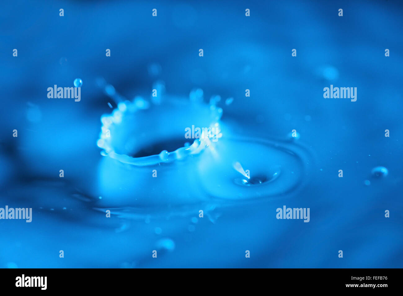 Blue liquid splashing Stock Photo - Alamy