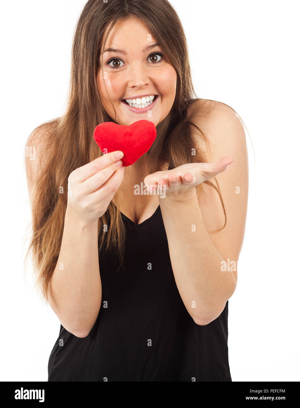young woman in love with a heart in hand Stock Photo - Alamy