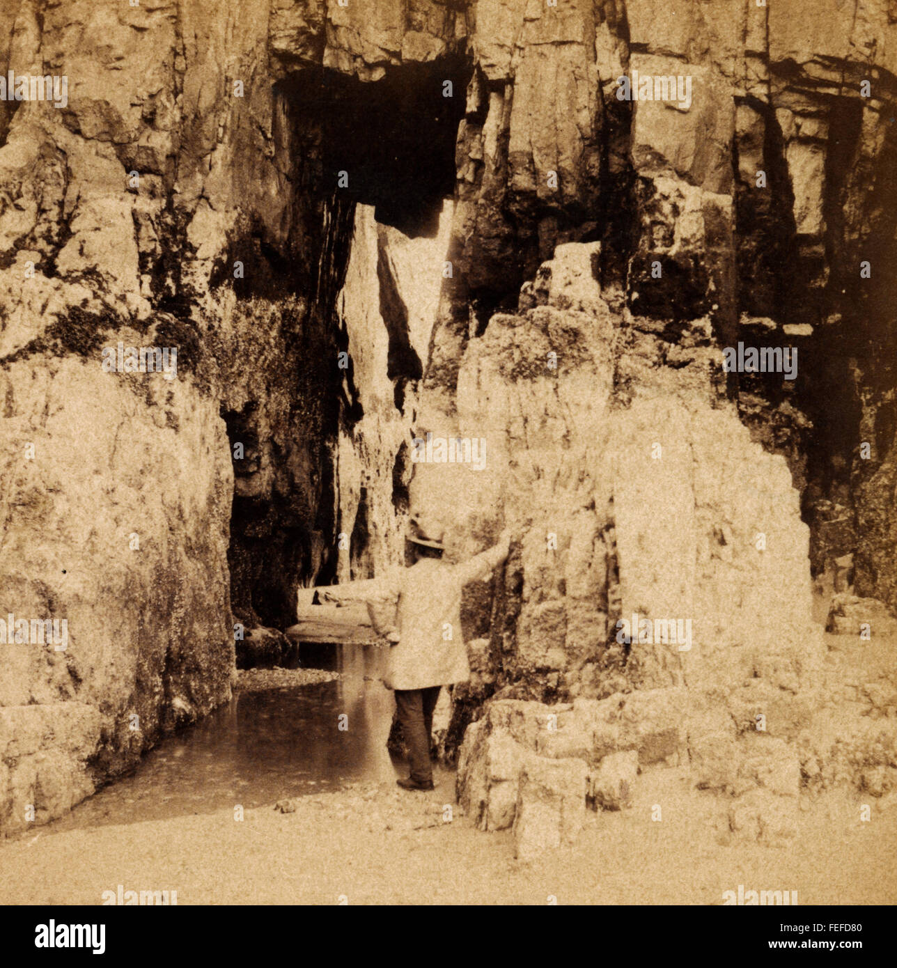 Cavern in St. Catherine's Rock, Tenby, Wales, UK about 1860s Stock ...