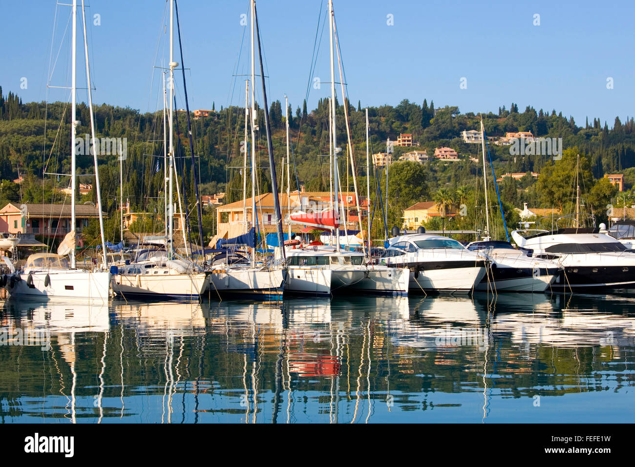 Gouvia, Corfu, Ionian Islands, Greece. Yachts reflected in the tranquil ...