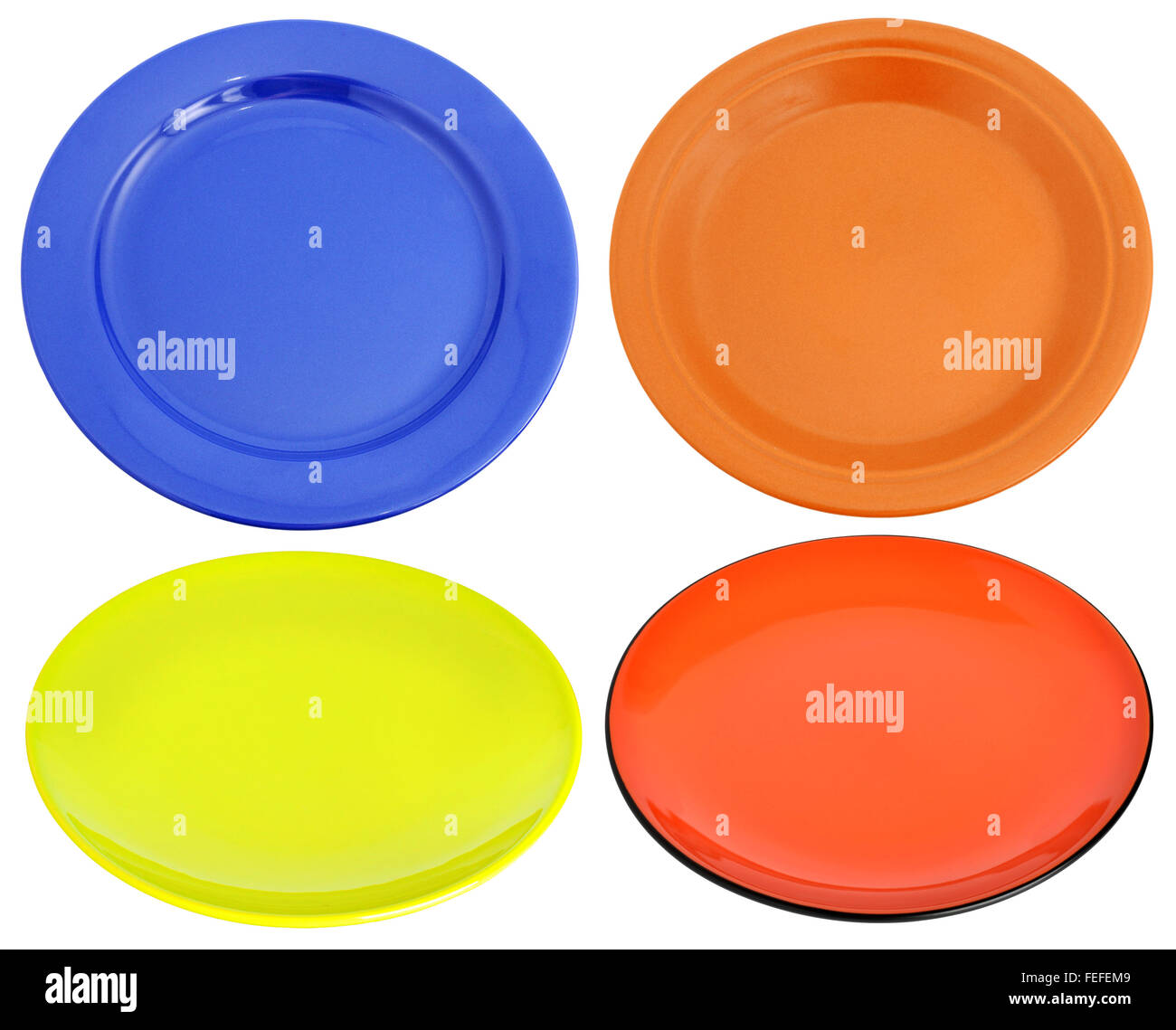 Multi-colored ceramic plates isolated on the white background Stock ...