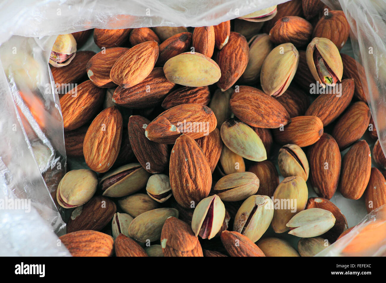Background texture of assorted mixed nuts including almonds and ...