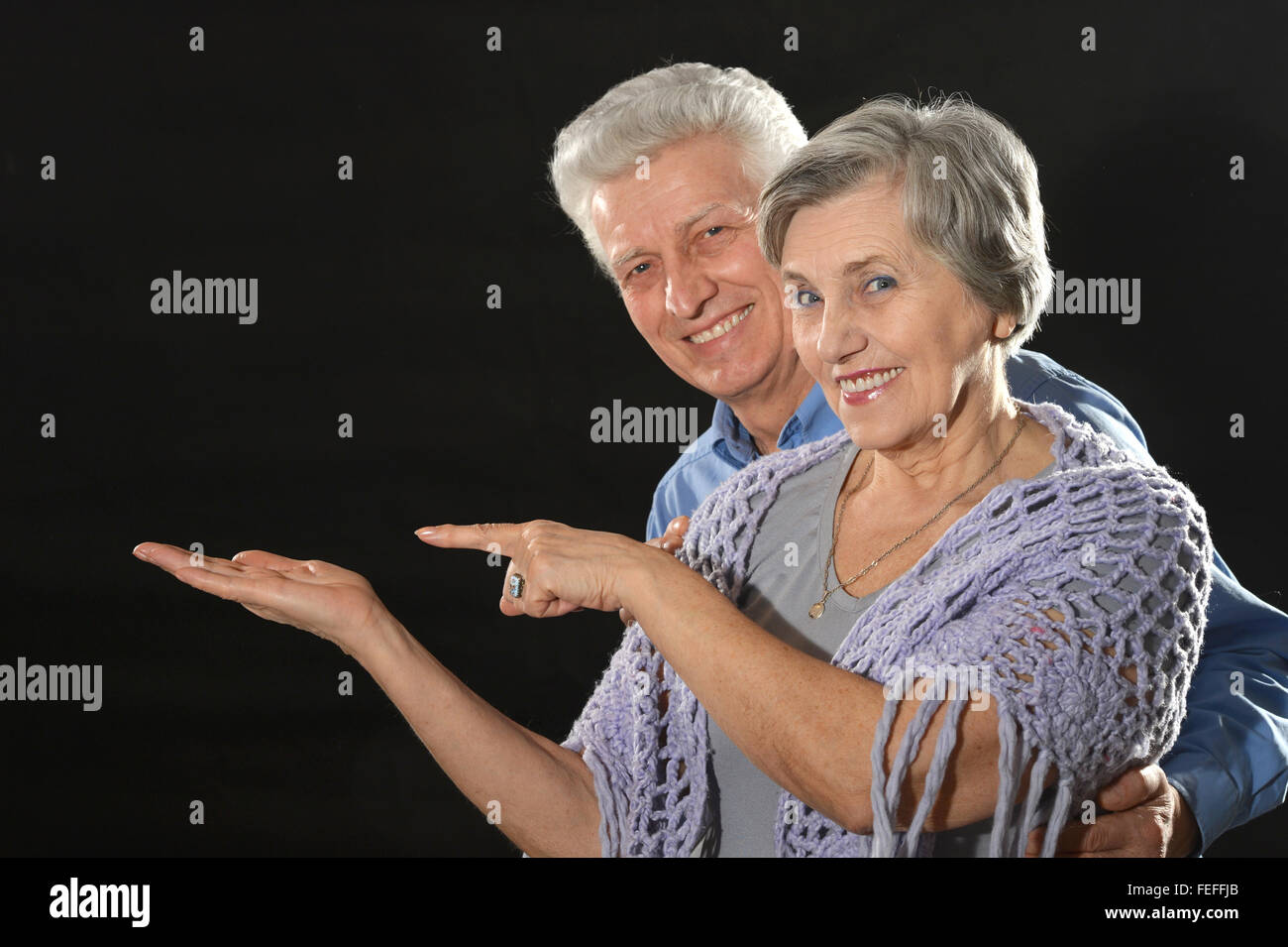 elderly couple advertising products Stock Photo - Alamy
