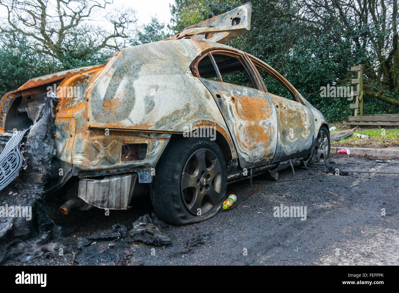 Abandoned fire damaged car Stock Photo - Alamy