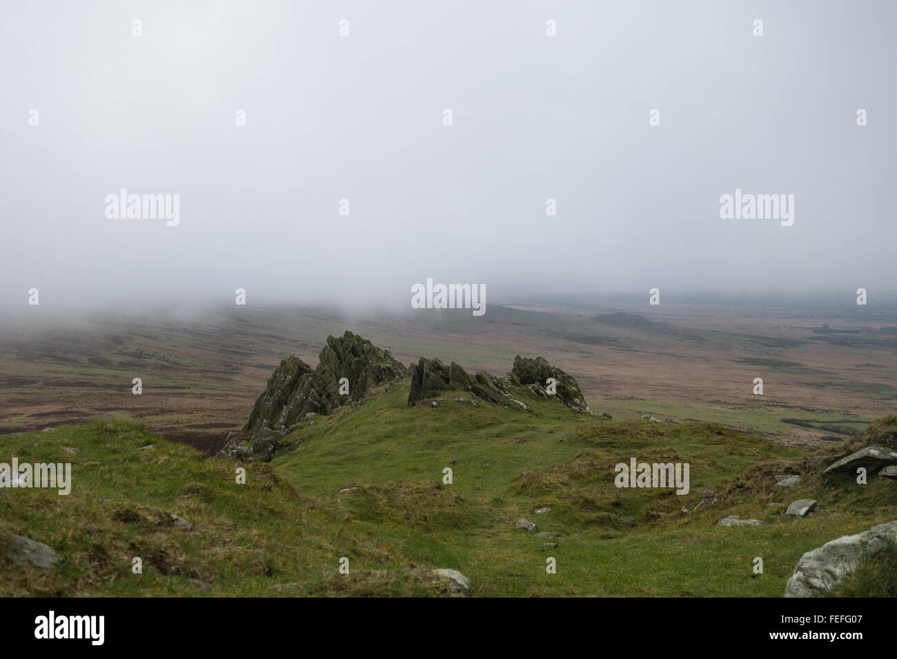 Preseli Hills under clouds seen from Foel Drygarn. Carn Alw can be seen ...