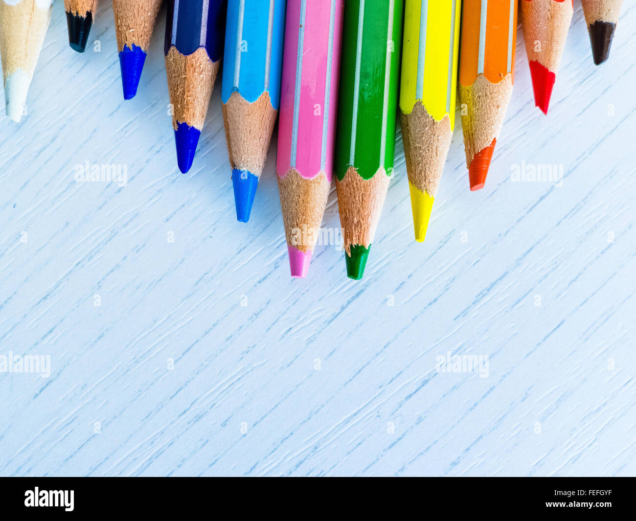 Colored pencils on white Stock Photo - Alamy