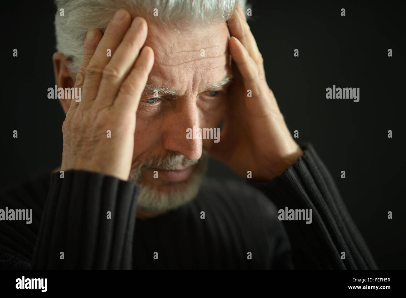 Sad senior man at home Stock Photo - Alamy