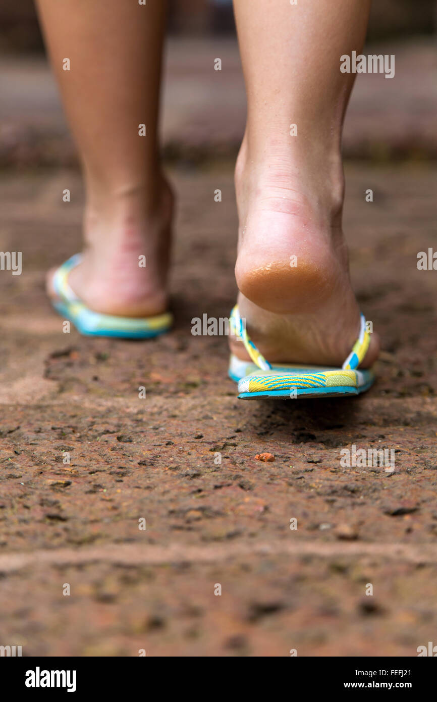 Legs in summer slippers Stock Photo - Alamy