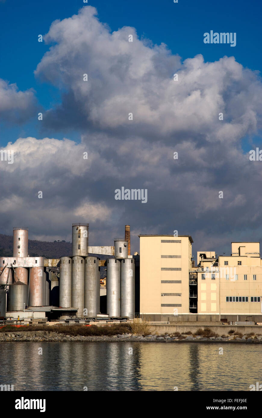 Complex factory in morning light Stock Photo - Alamy