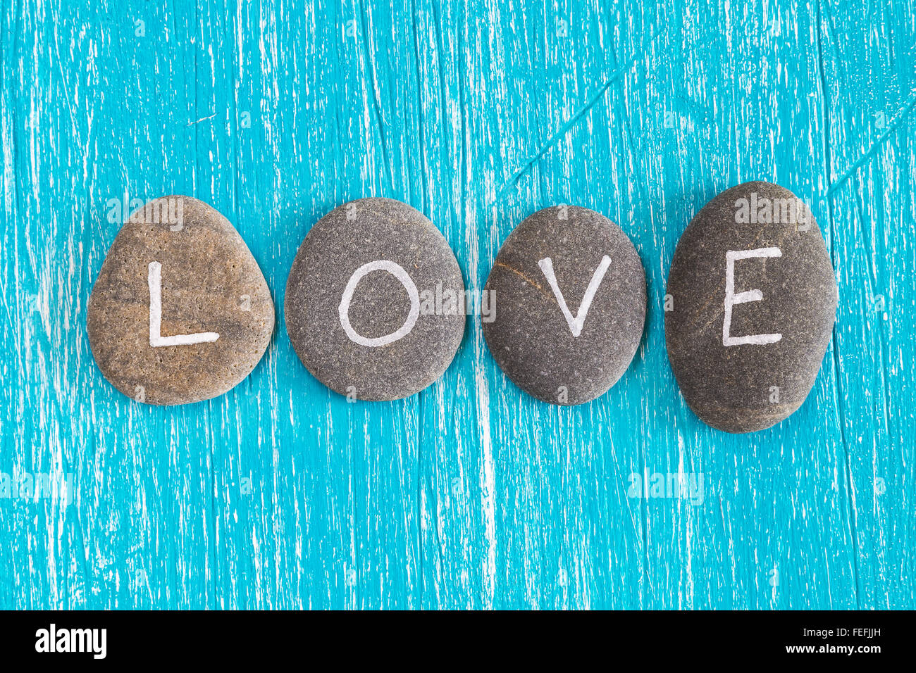 Love written on pebbles Stock Photo - Alamy