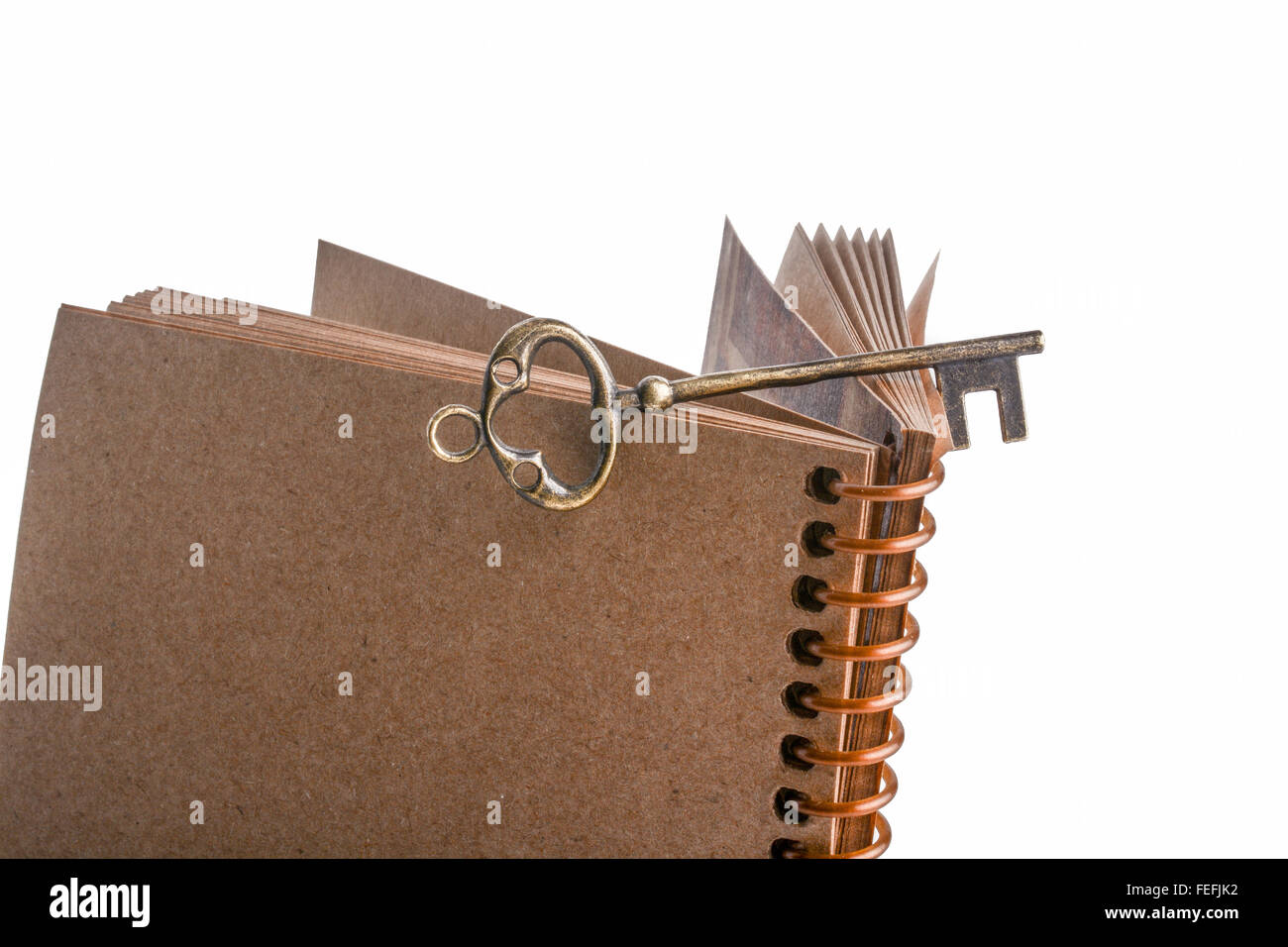 Spiral notebook and key Stock Photo - Alamy