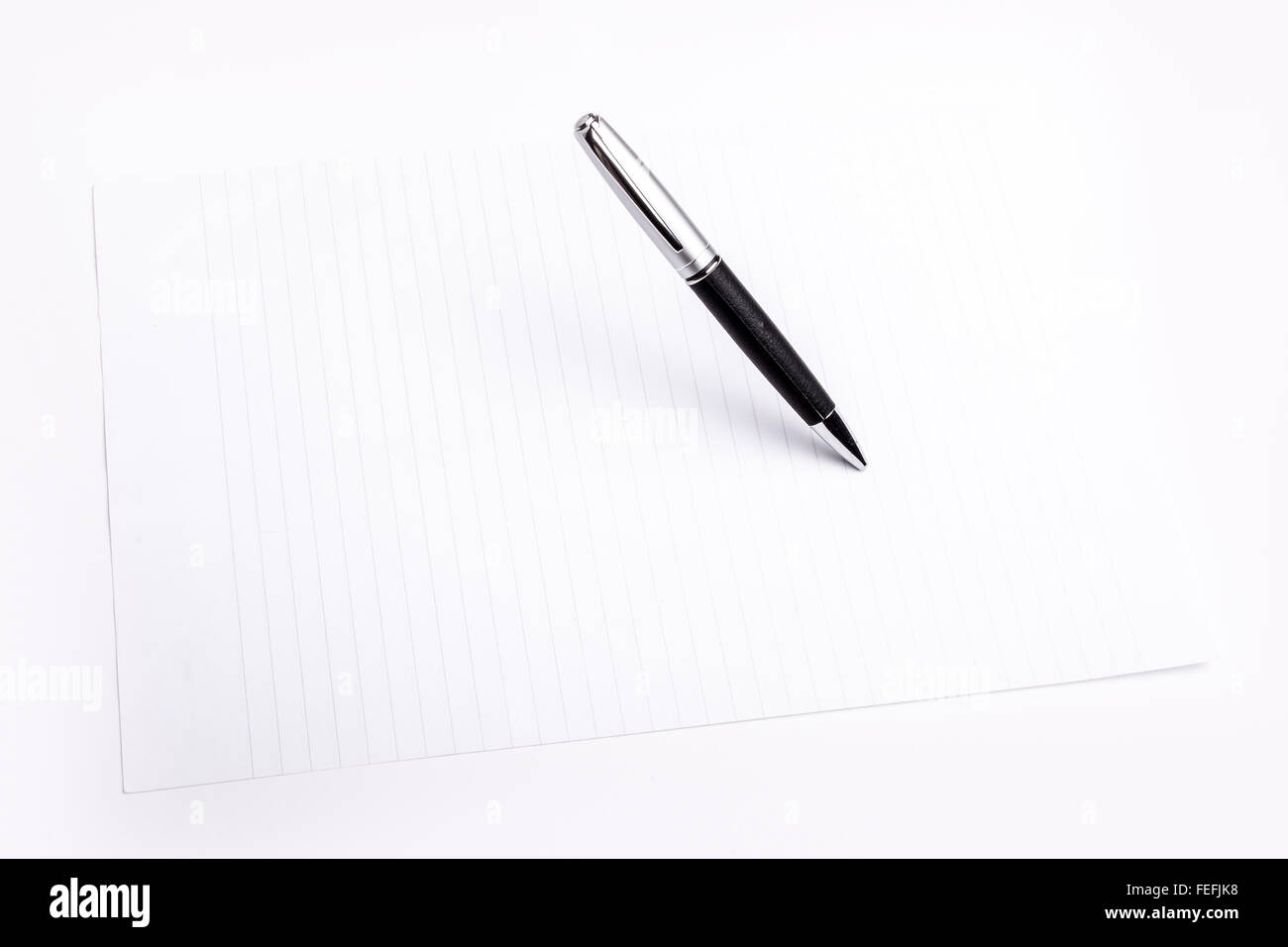 Pen and plain color paper on an isolated background Stock Photo - Alamy