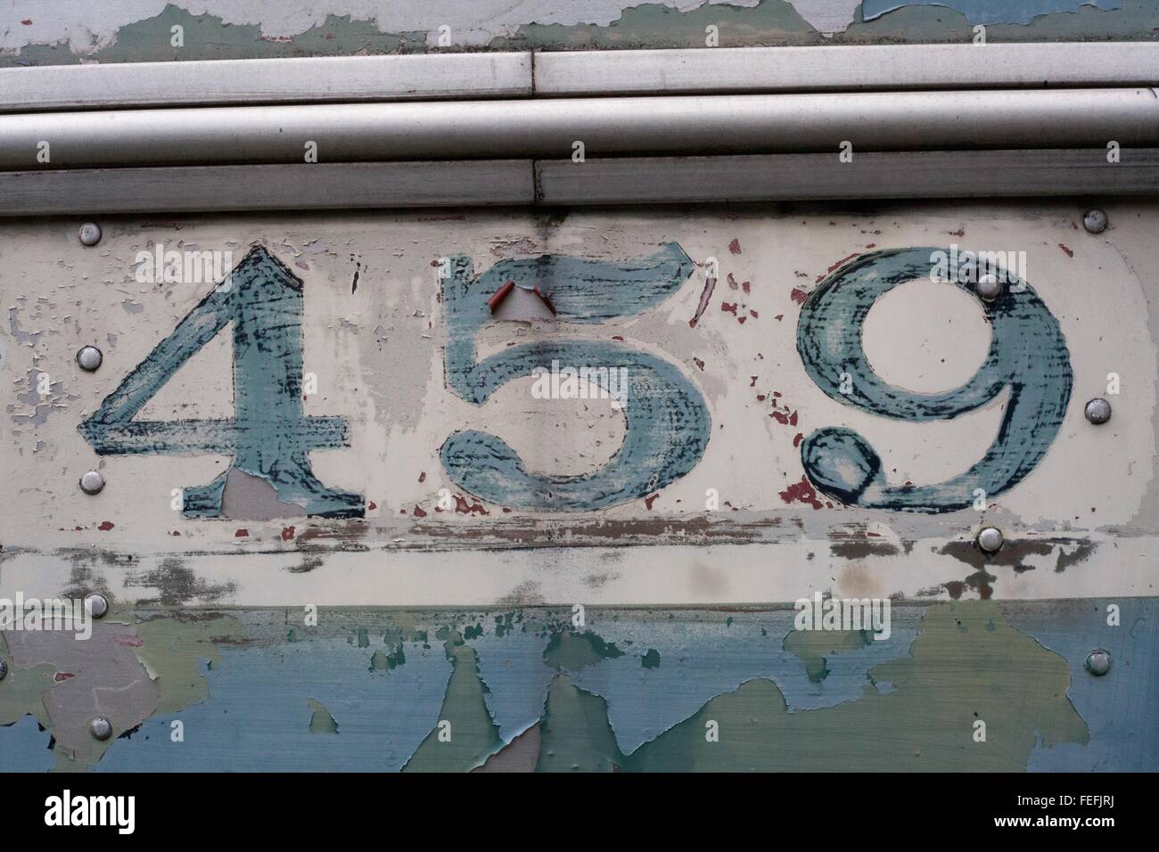 459 numbers on an old Brill Trolley Bus, worn faded and scratched ...