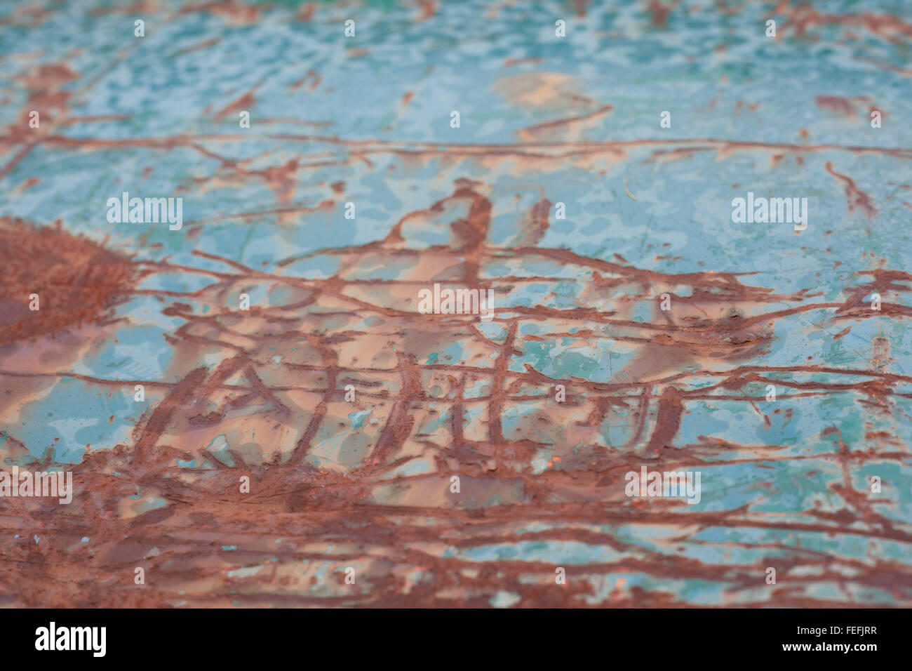 blue scratched and worn paint, old and rusty and scratched metal ...