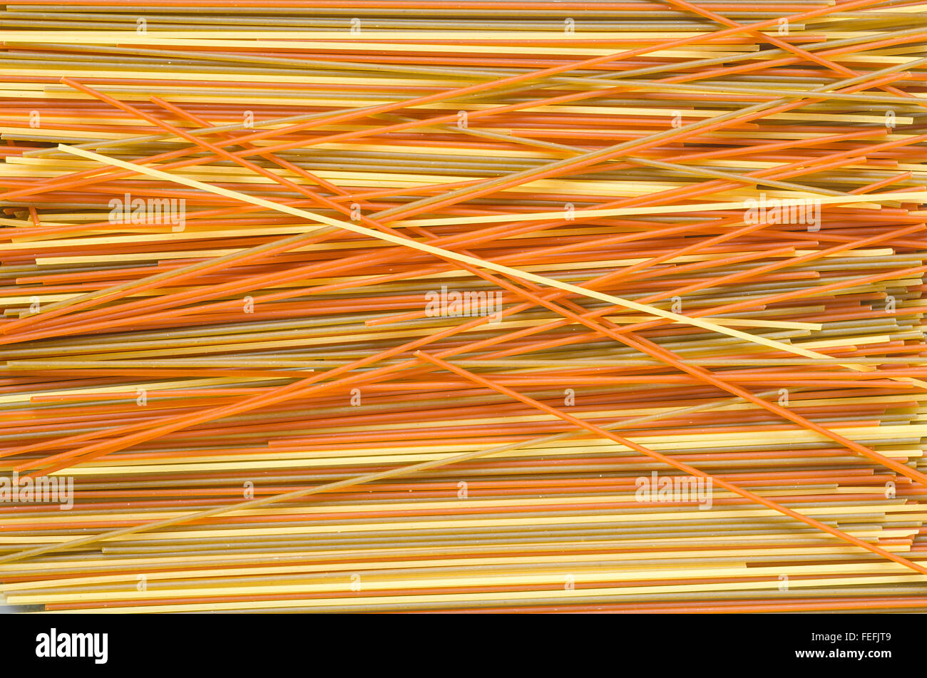 multicolored spaghetti pasta background texture Stock Photo - Alamy