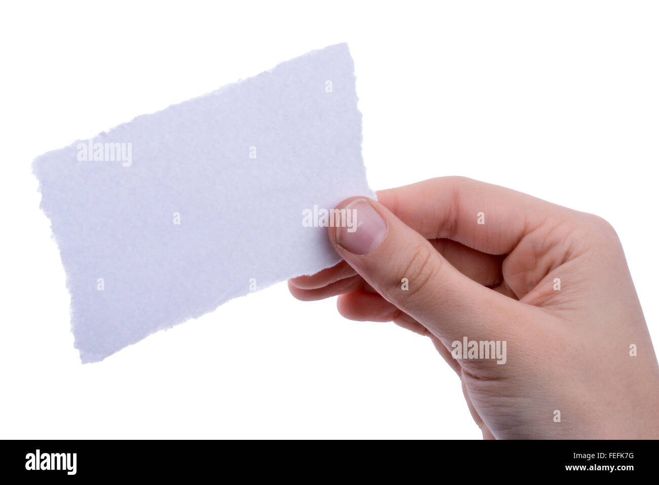 hand holding a piece of torn paper Stock Photo - Alamy