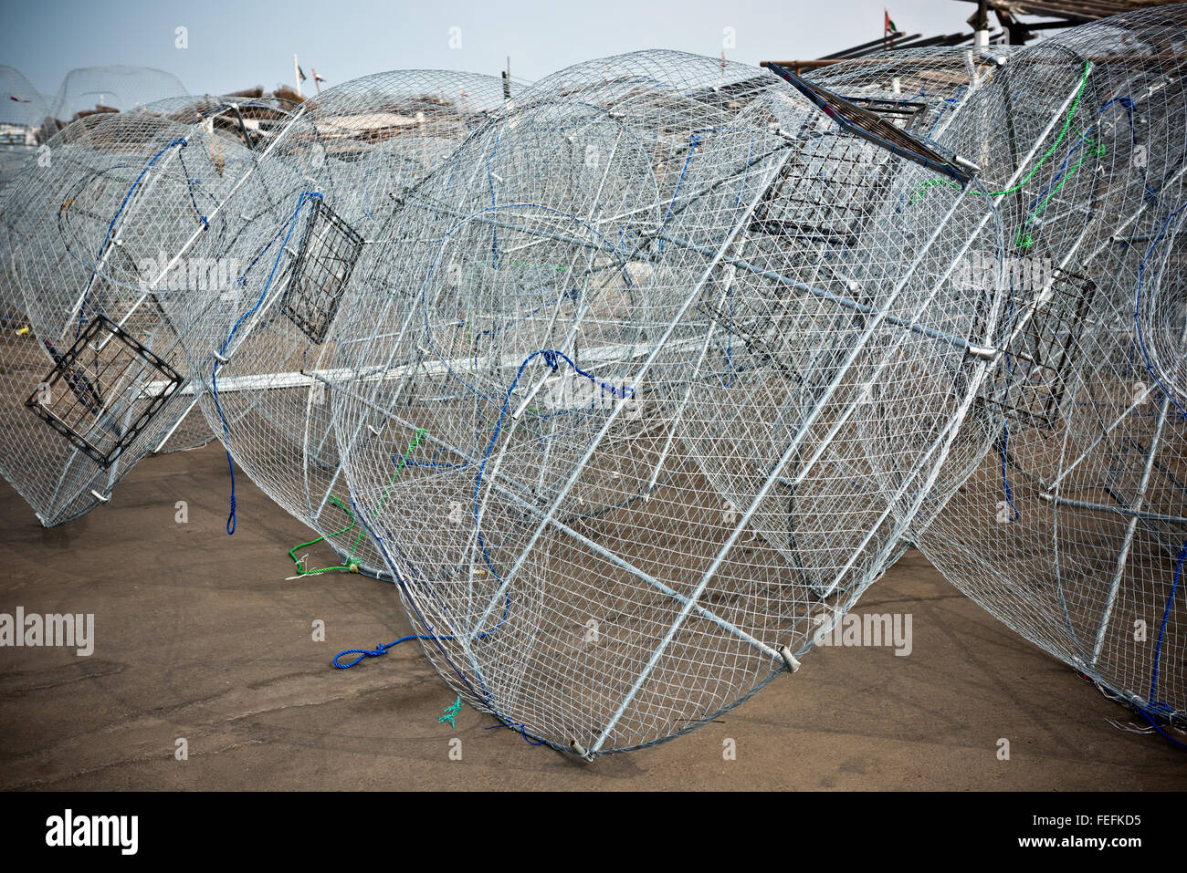 Metal fishing nets in a port. Horizontal shot Stock Photo - Alamy