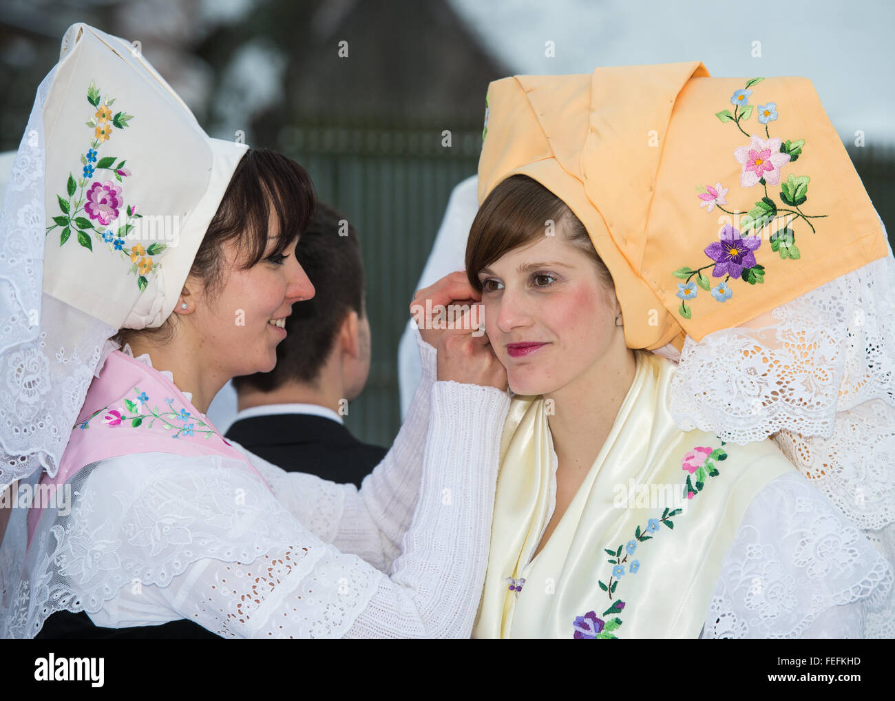 Two women in original Sorbian festivity costumes partaking in the ...