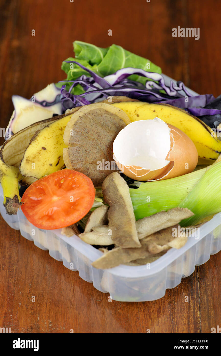 Kitchen vegetable and fruit food waste, collected in re-used packaging ...