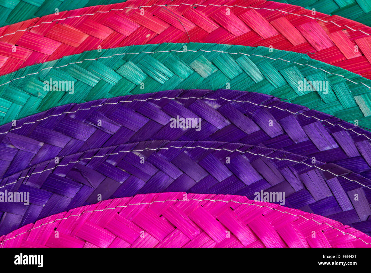 Abstract colorful background of woven straw Stock Photo - Alamy