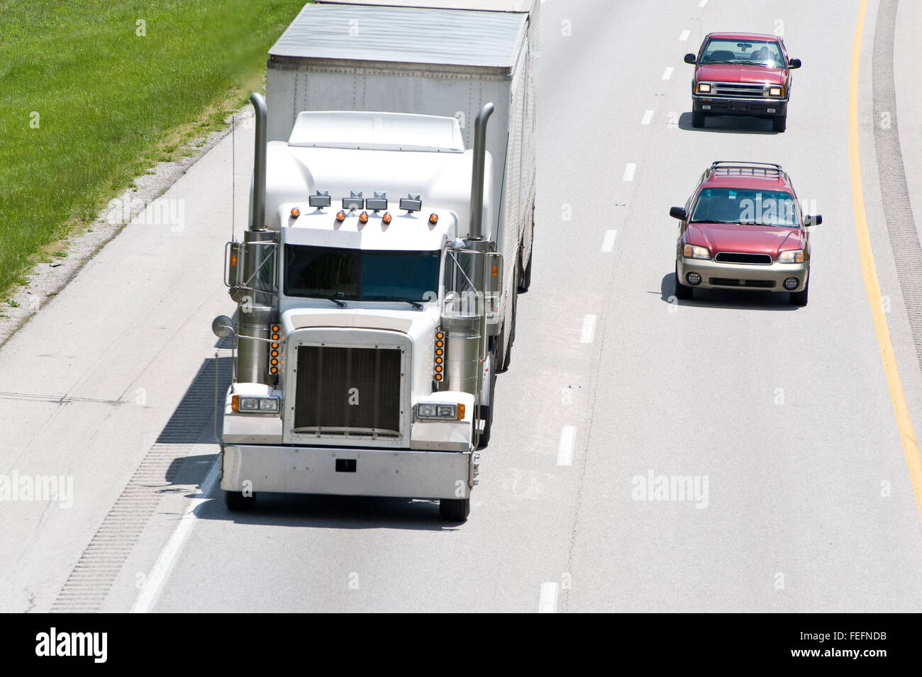 Cars passing truck hi-res stock photography and images - Alamy