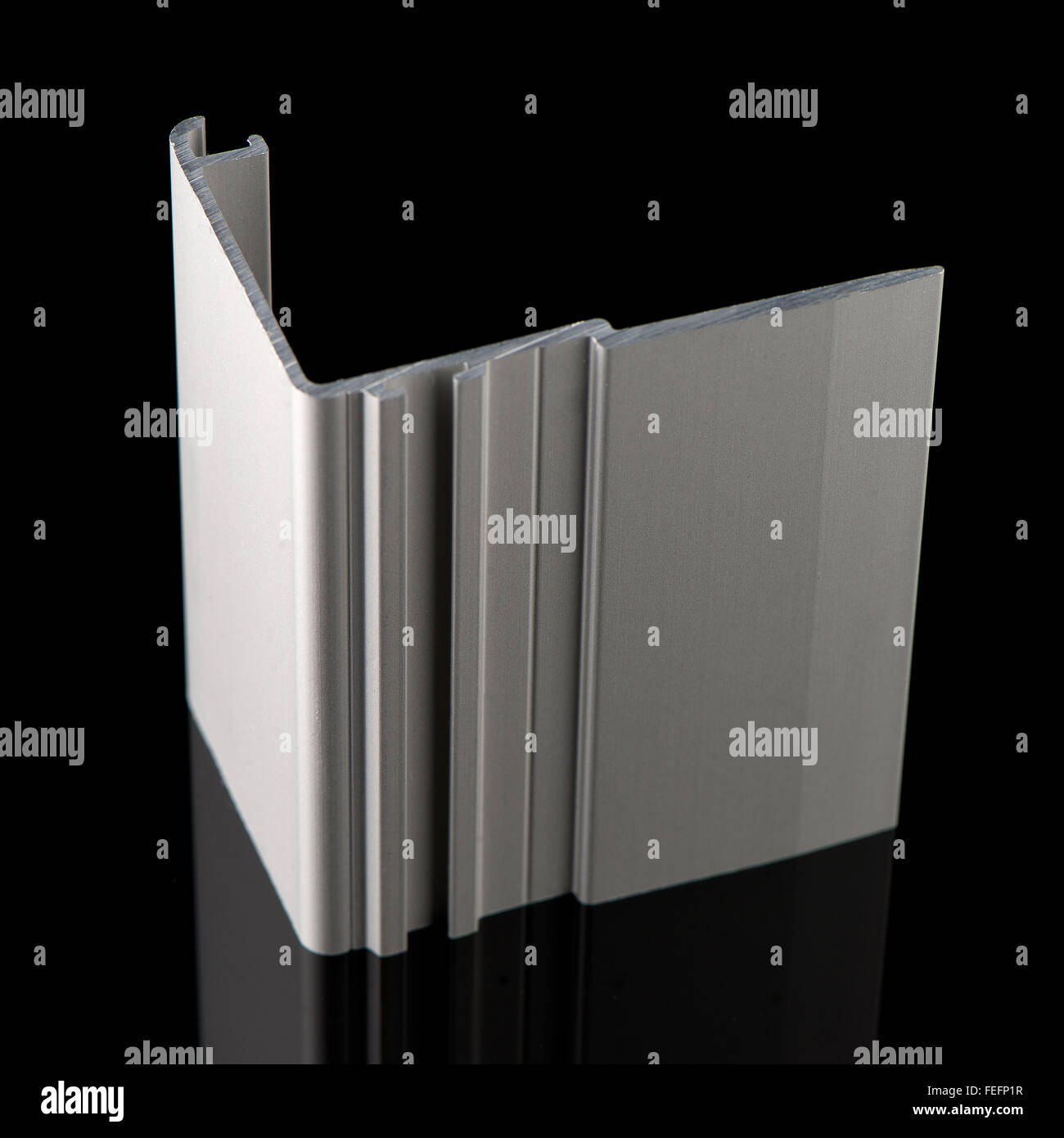 Aluminium profile sample isolated on black background Stock Photo - Alamy
