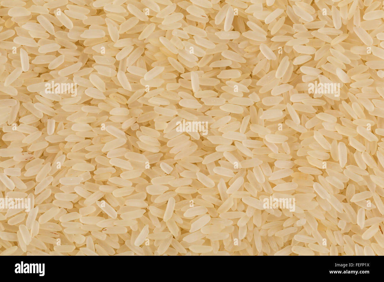 Uncooked rice background close up shot image Stock Photo - Alamy