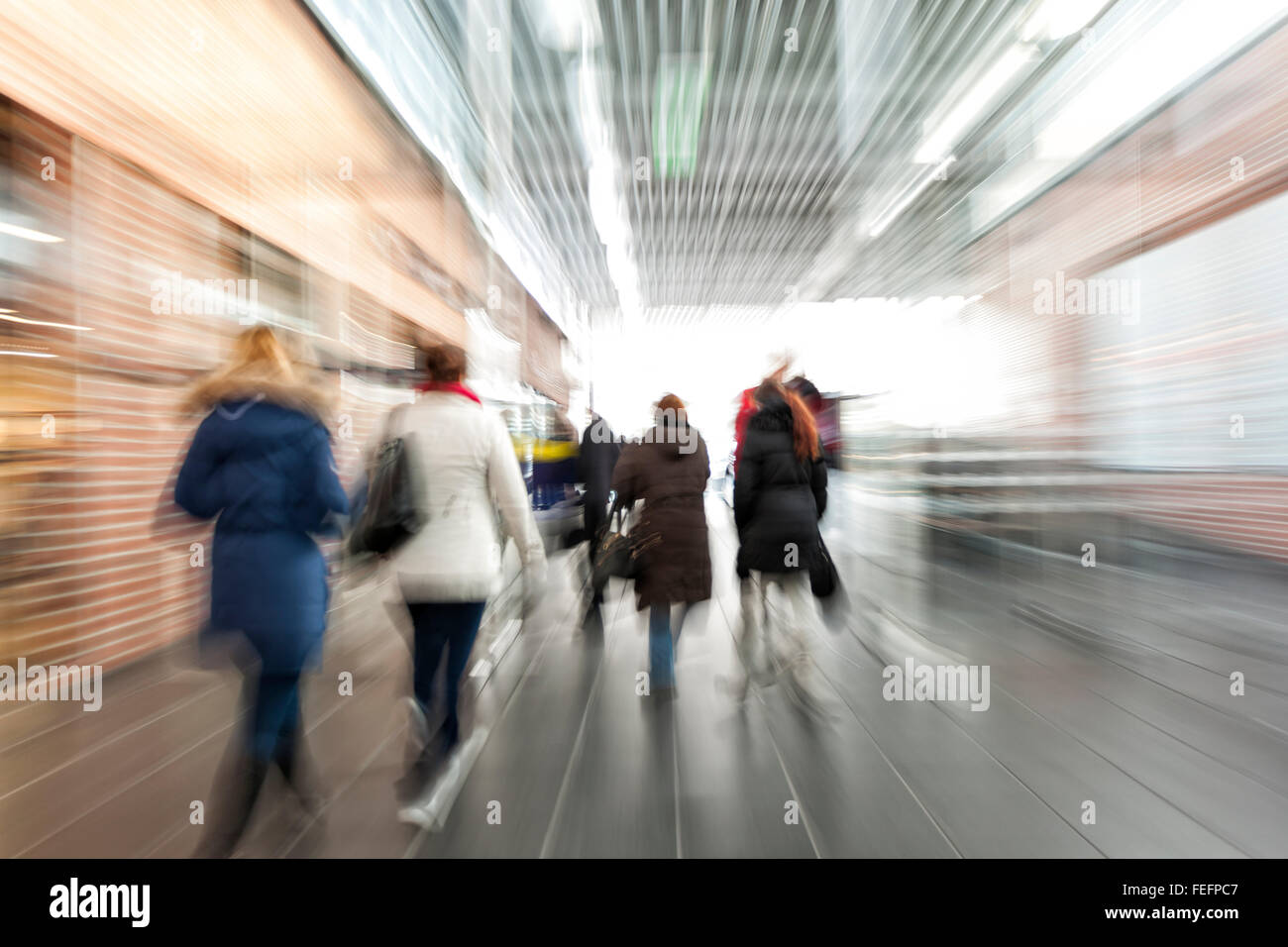 A shopper walking past a store window Stock Photo - Alamy