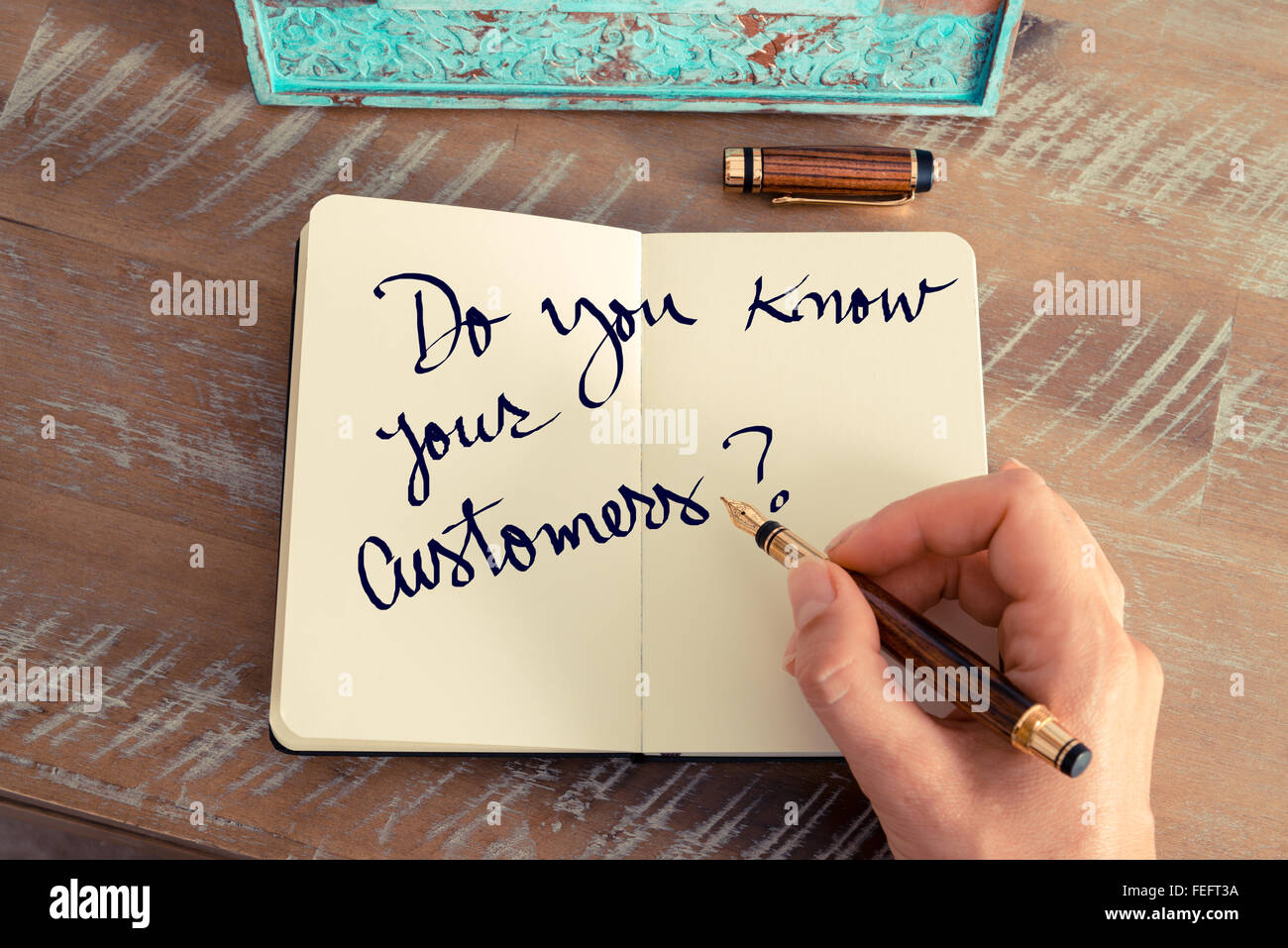 Retro effect and toned image of a woman hand writing a note with a ...