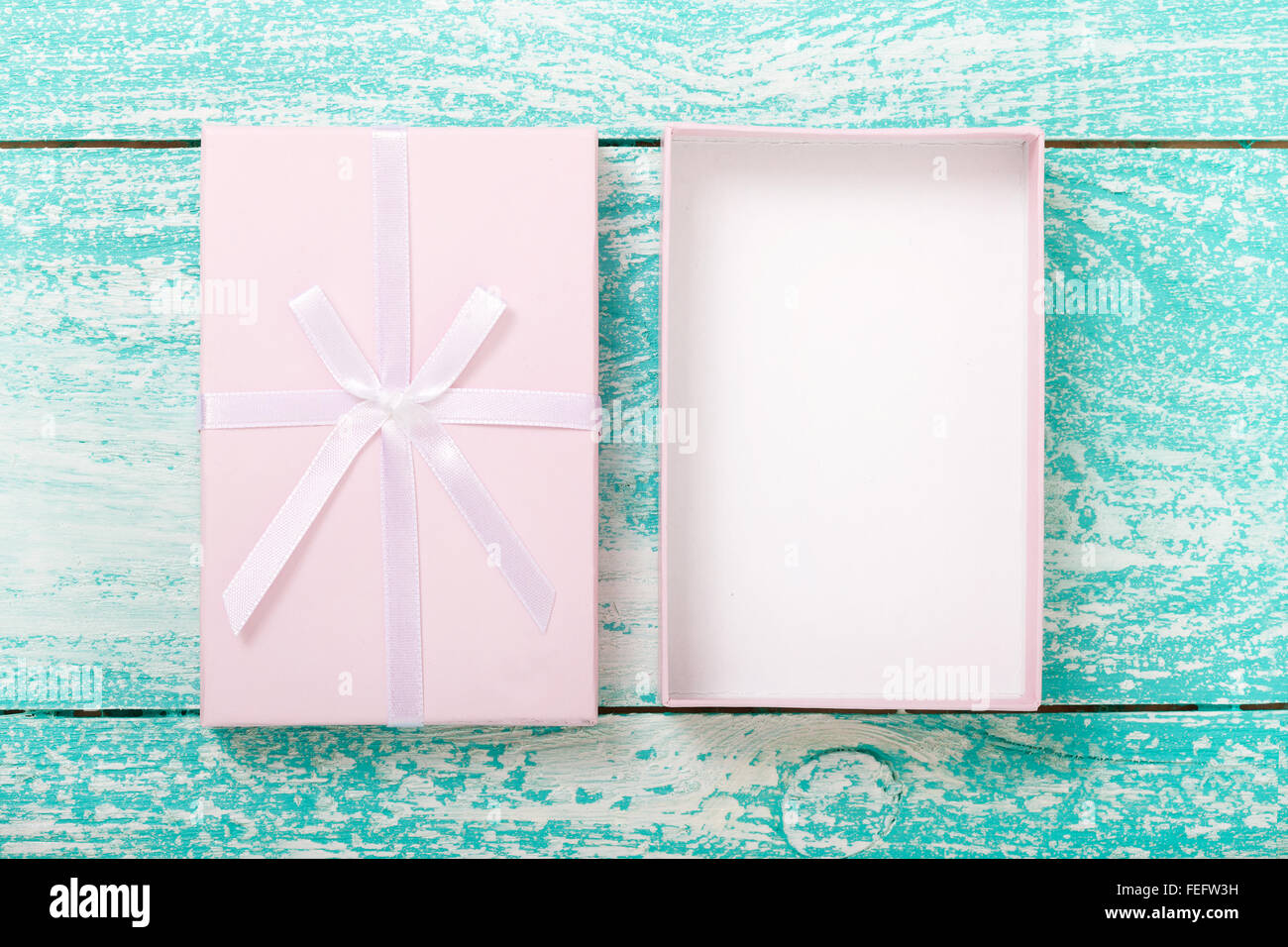 Open gift box on blue vintage wooden desk top view Stock Photo - Alamy Open gift box on blue vintage wooden desk top view Stock Photo - Alamy