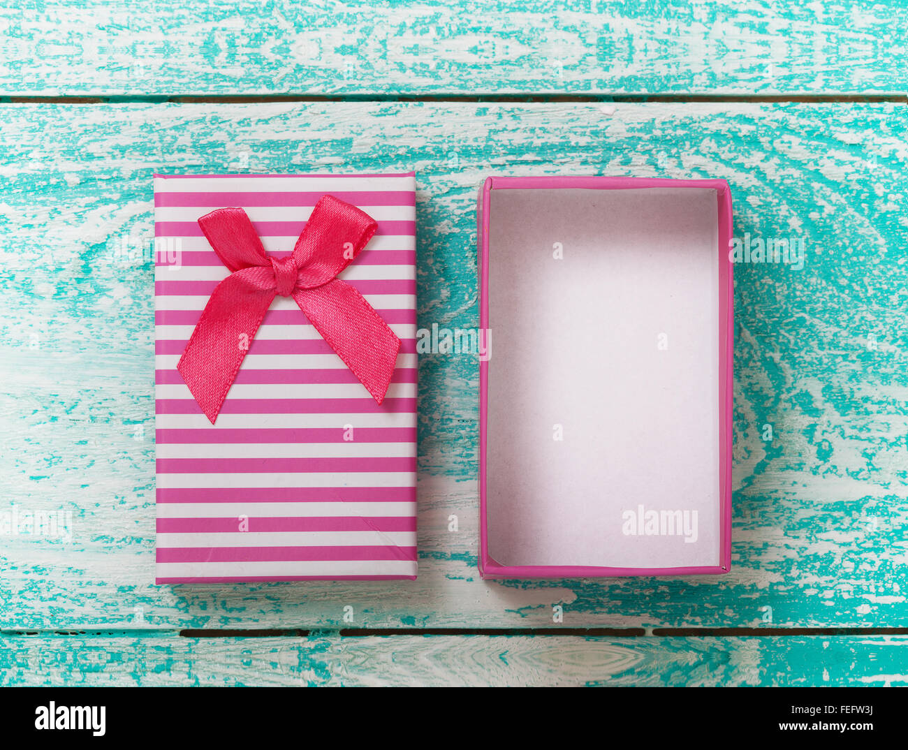 Open gift box on blue vintage wooden desk top view Stock Photo - Alamy Open gift box on blue vintage wooden desk top view Stock Photo - Alamy