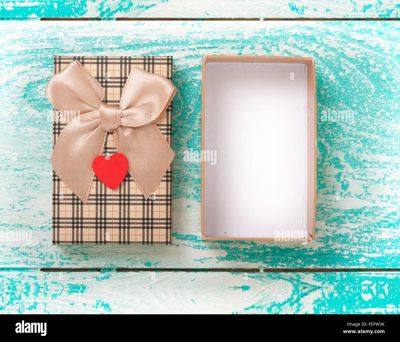 Open gift box on blue vintage wooden desk top view Stock Photo - Alamy Open gift box on blue vintage wooden desk top view Stock Photo - Alamy