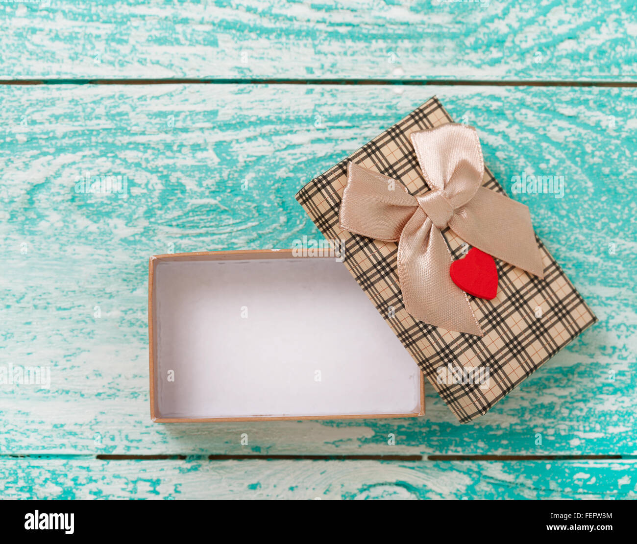Open gift box on blue vintage wooden desk top view Stock Photo - Alamy Open gift box on blue vintage wooden desk top view Stock Photo - Alamy