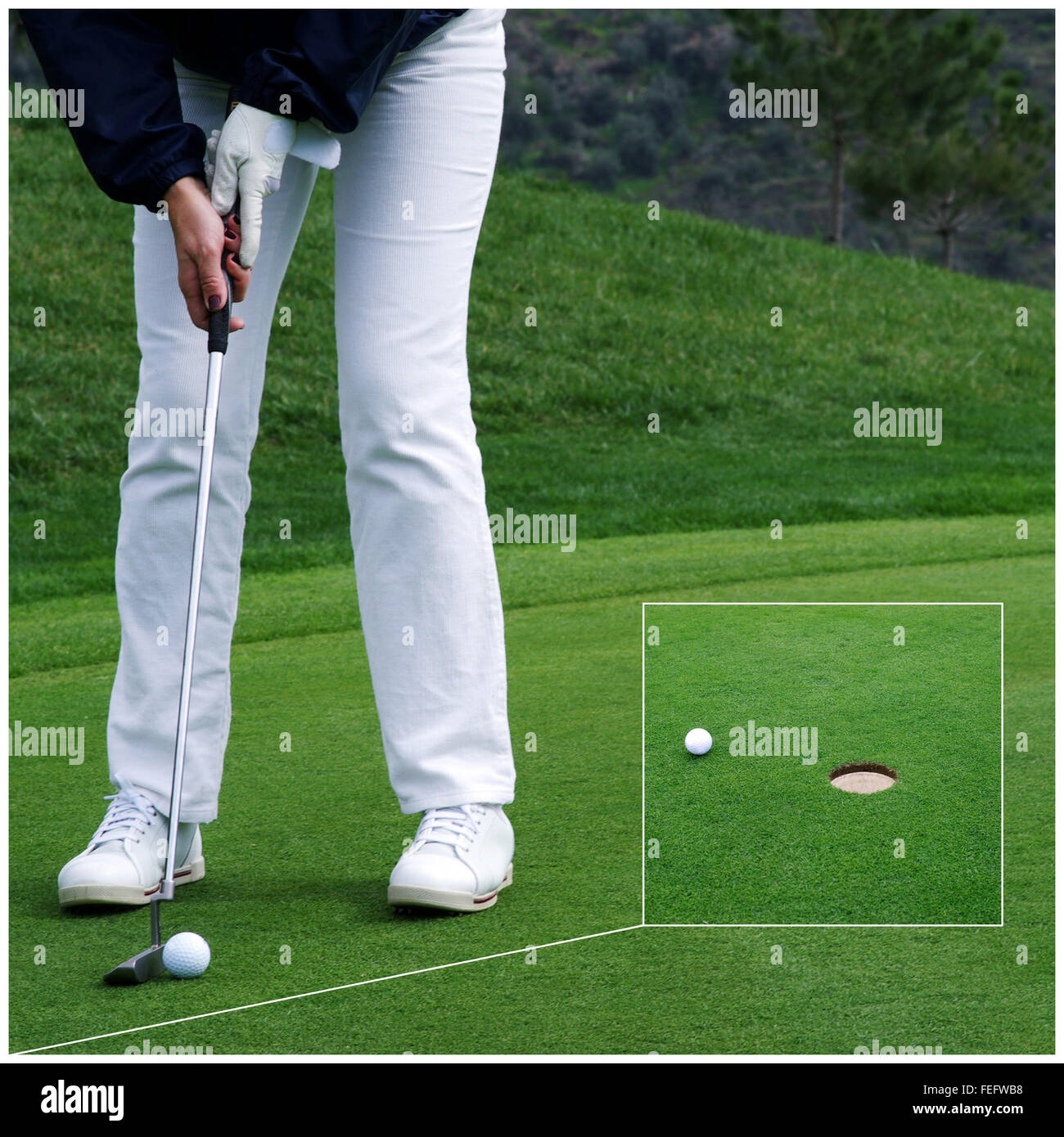 Golfer putting the ball up close Stock Photo - Alamy