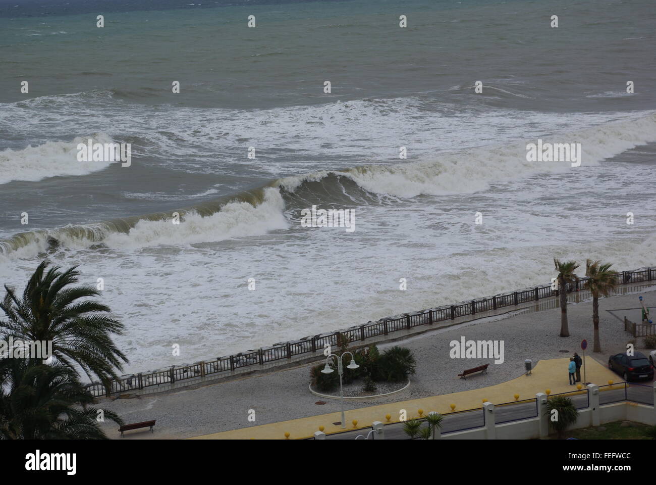 Waves and surf on a windy day in Benalmadena, Spain Stock Photo - Alamy