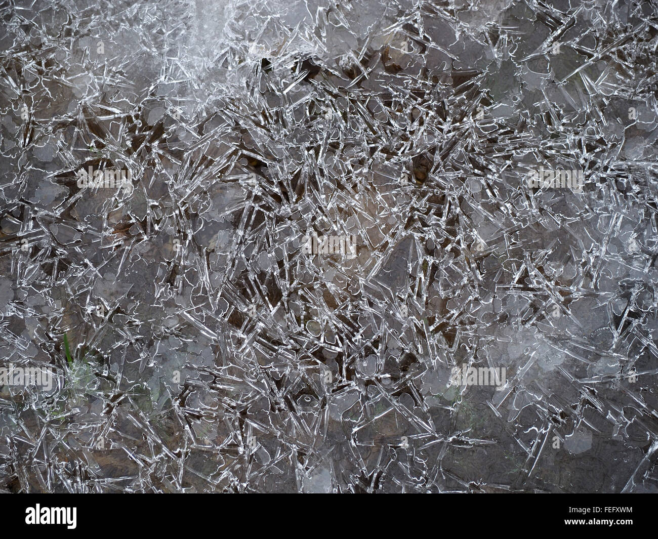 geometric zigzag pattern of ice crystals on a frozen country path Stock ...